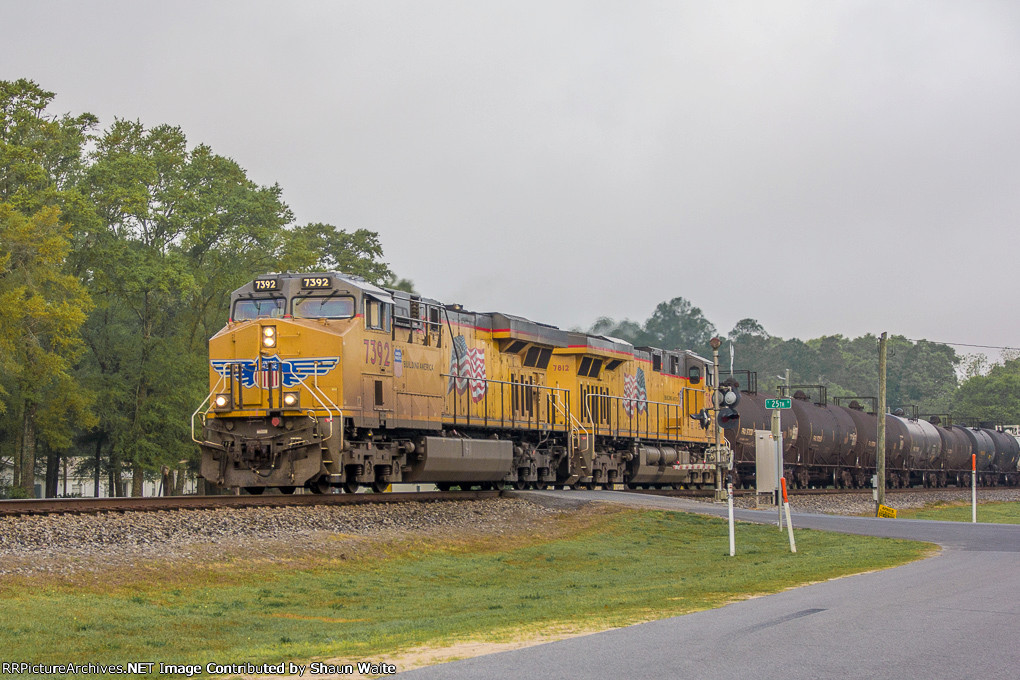 UP 7392 breaks thru the dawn mist and catches the first rays of Florida sunshine